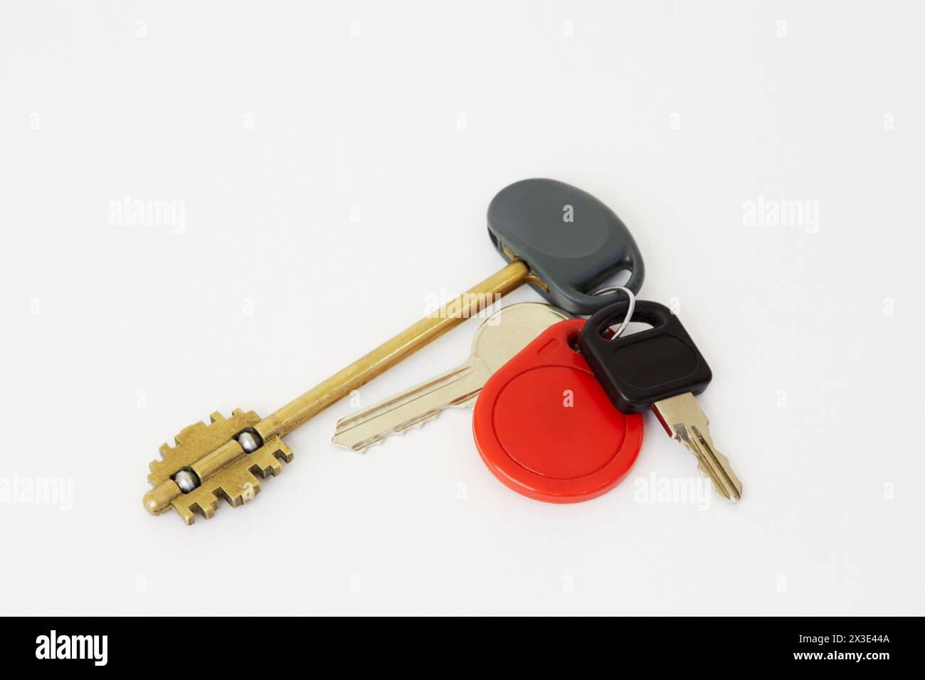 Set of keys on ring on white background Stock Photo - Alamy