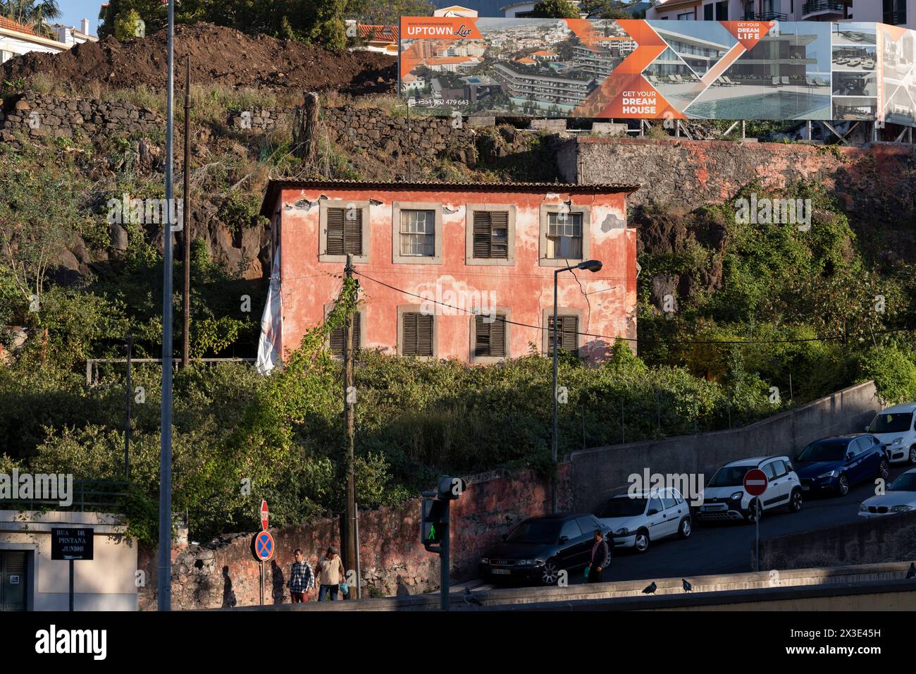 An historical house sits derelict, soon to be dominated by a new ...