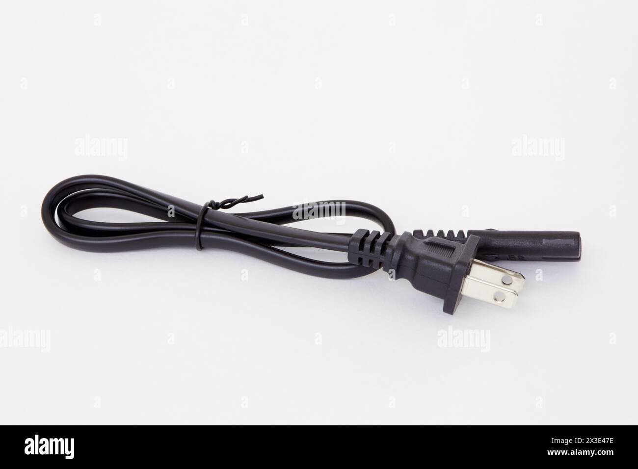 Black power cable on white background Stock Photo - Alamy
