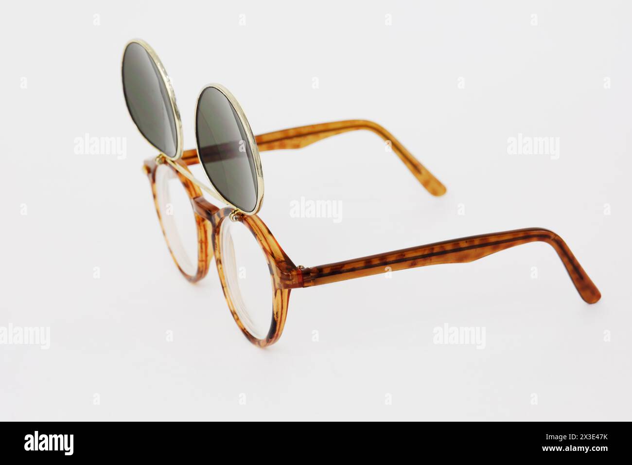 Flip up double lenses glasses on white background Stock Photo - Alamy