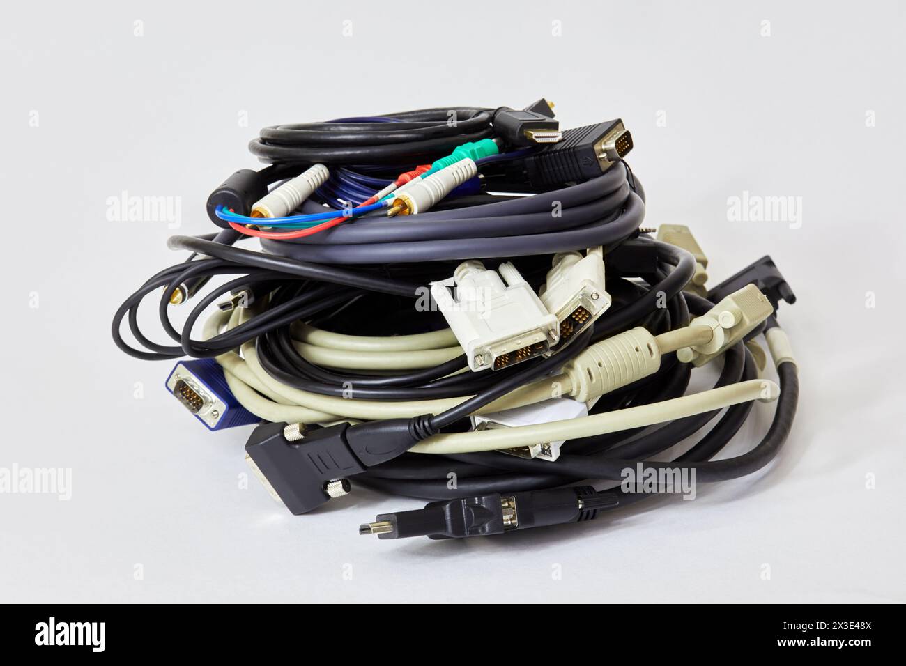 Pile of coiled computer cables on white background Stock Photo - Alamy