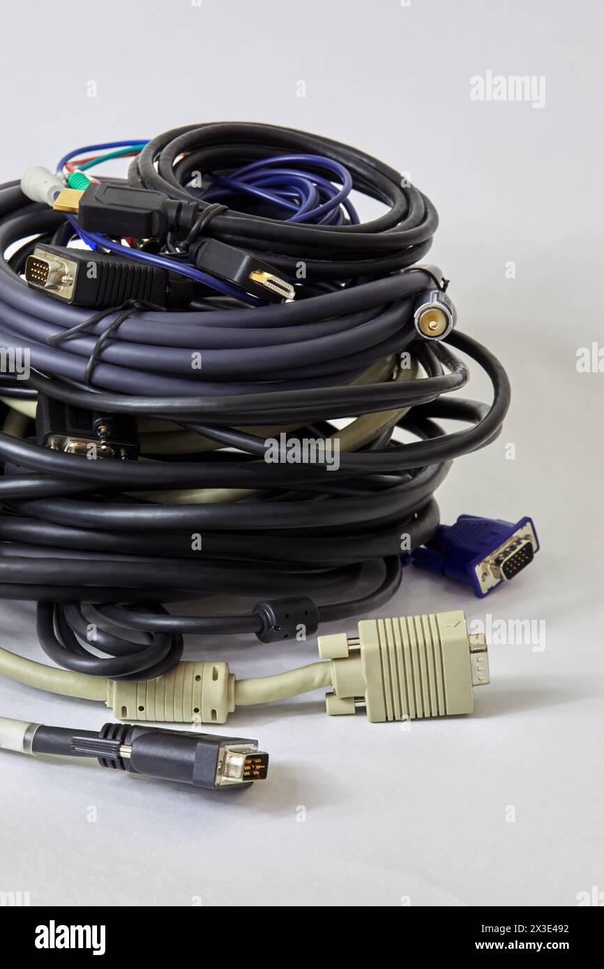 Pile of different coiled computer cables on white background Stock ...