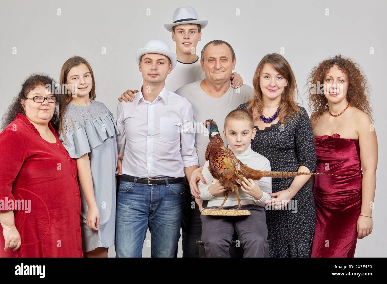 Group portrait of family of eight members in studio Stock Photo - Alamy