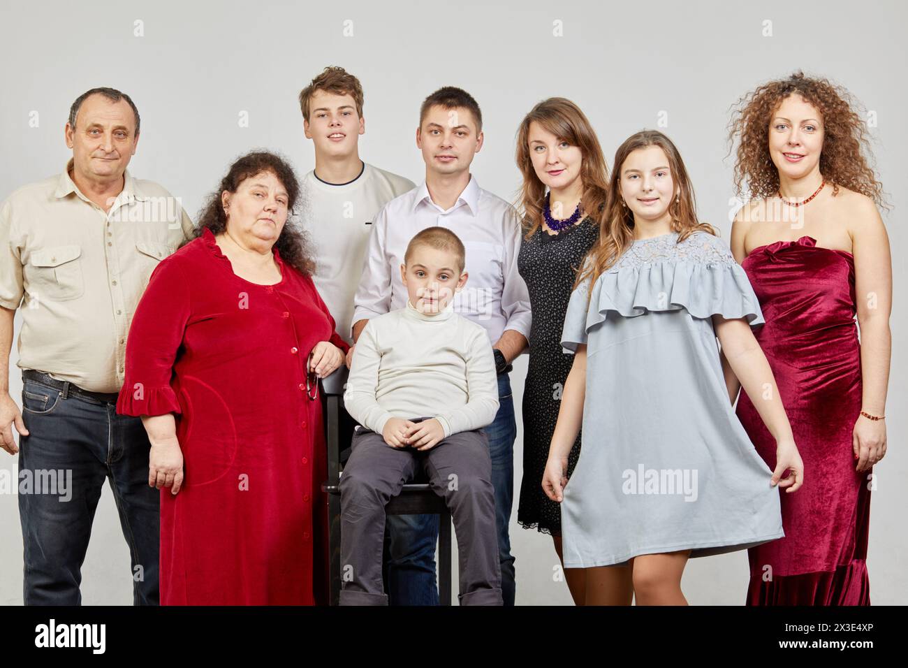 Portrait of family of eight members in studio Stock Photo - Alamy