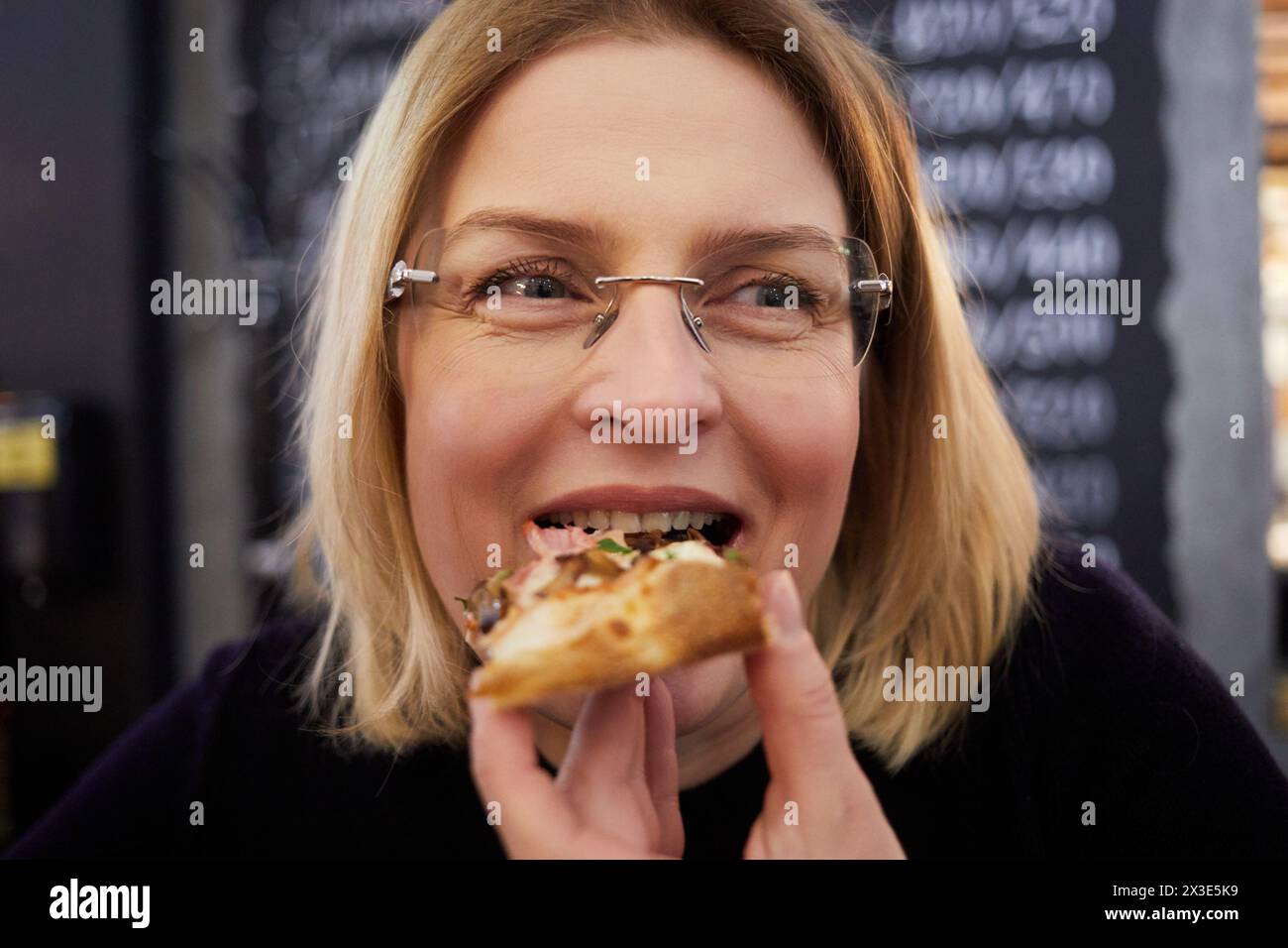 Closeup hungry woman in glasses hi-res stock photography and images - Alamy