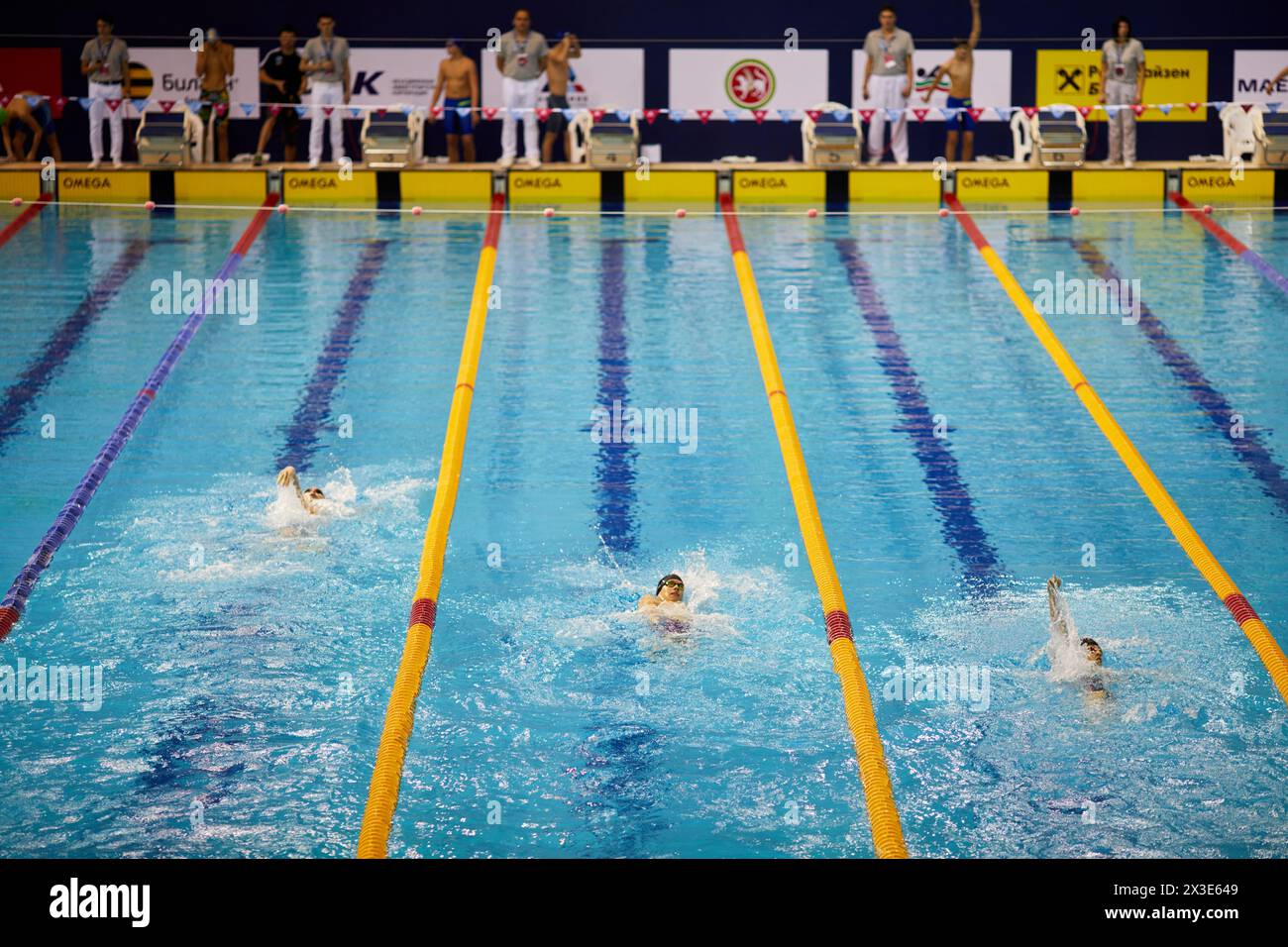 KAZAN, RUSSIA - DEC 09, 2017: Three women swim backstroke in ...