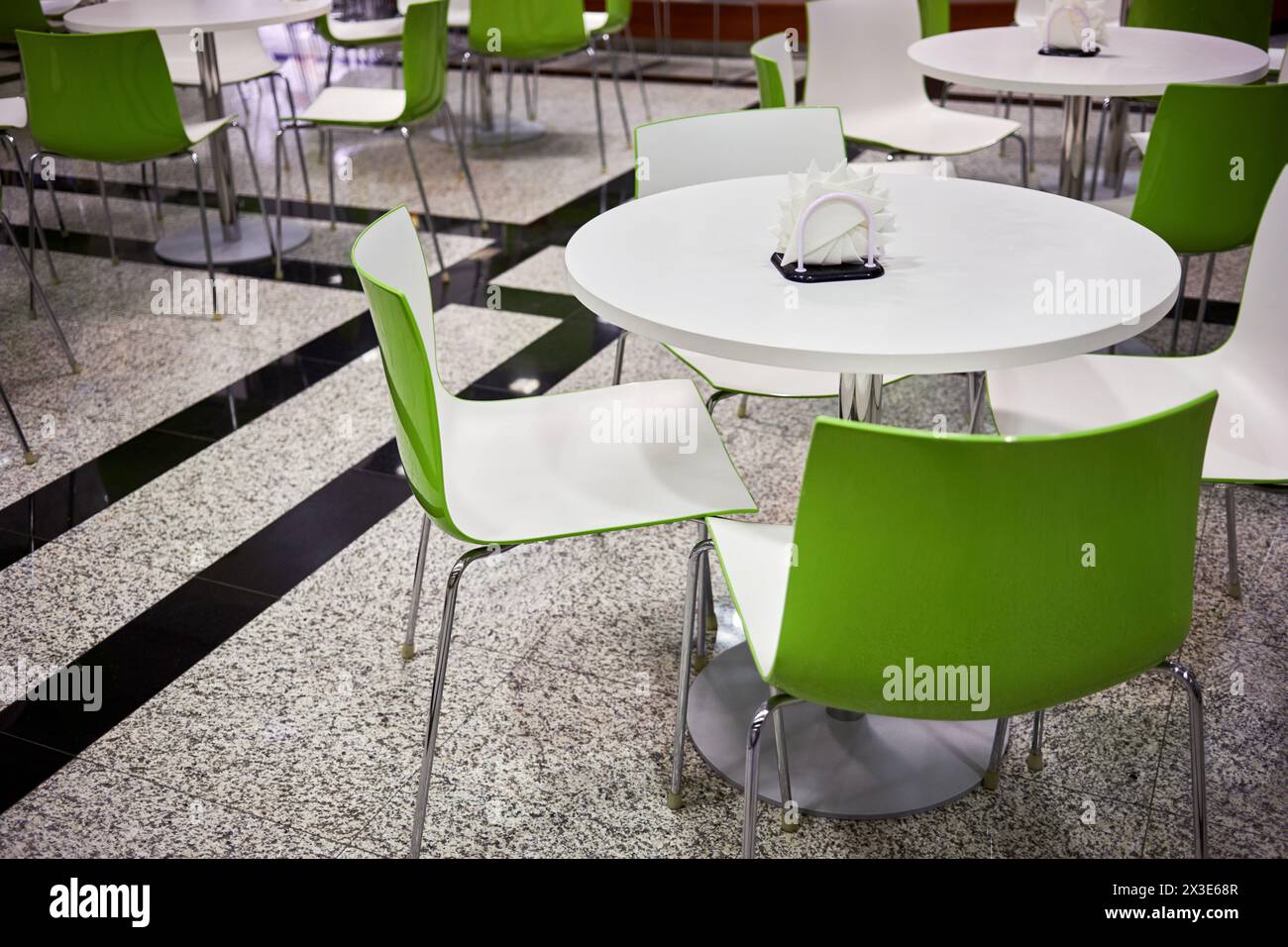 Interior of cafe with light plastic furniture Stock Photo - Alamy