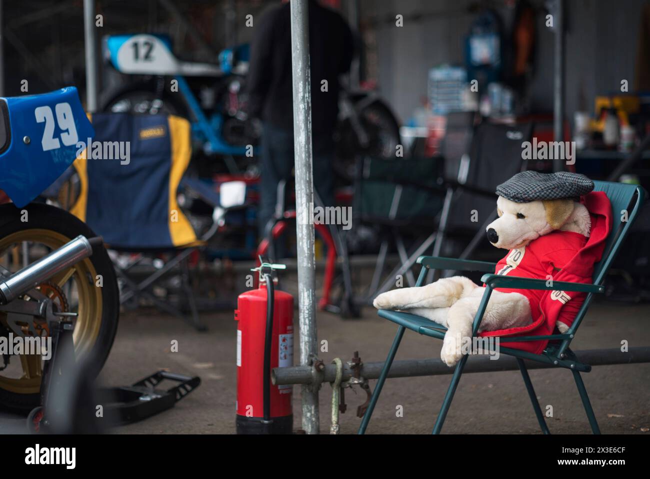 Toy dog mascot dressed in team colours of 1970 Smith Honda CR-S of Andy ...