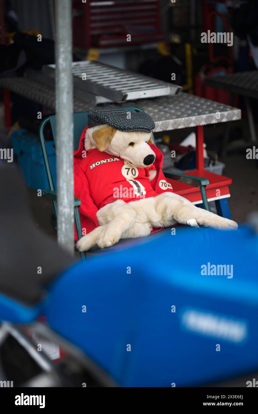 Toy dog mascot dressed in team colours of 1970 Smith Honda CR-S of Andy ...
