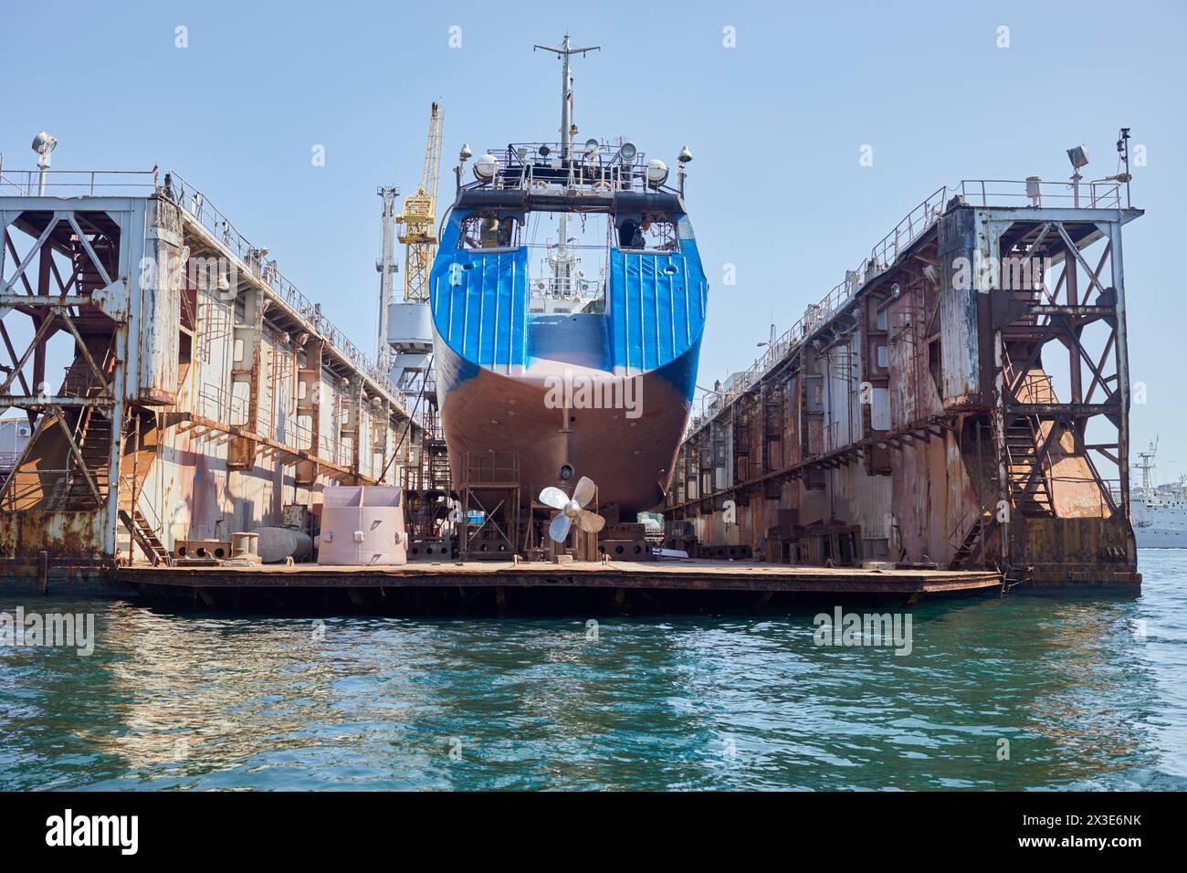 Ship in floating dock during repairing works Stock Photo - Alamy