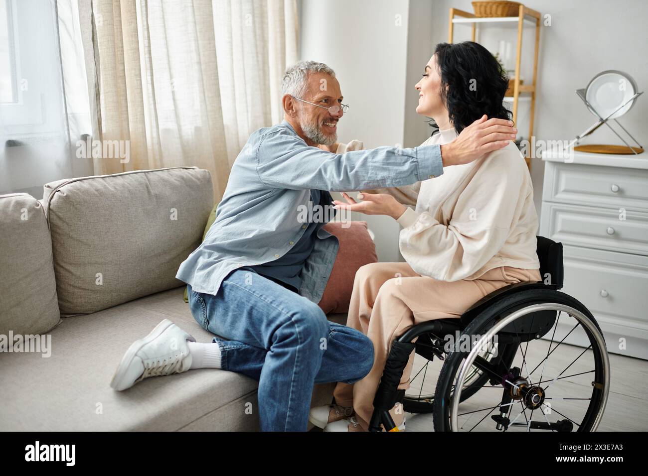 Woman in wheelchair hugging hi-res stock photography and images - Alamy