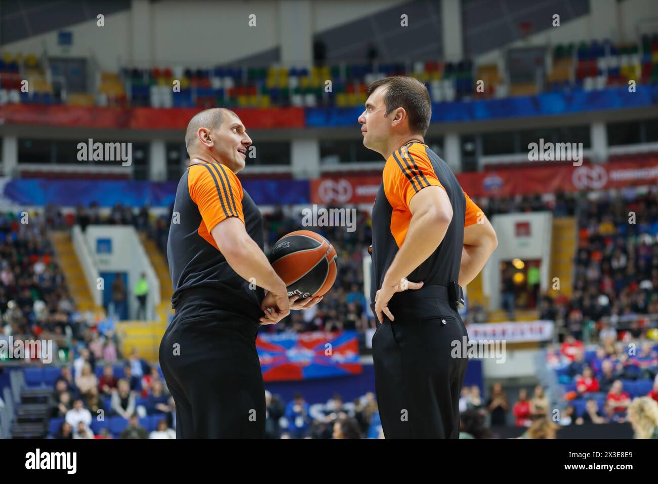 Two referees talk before basketball game in stadium Stock Photo - Alamy