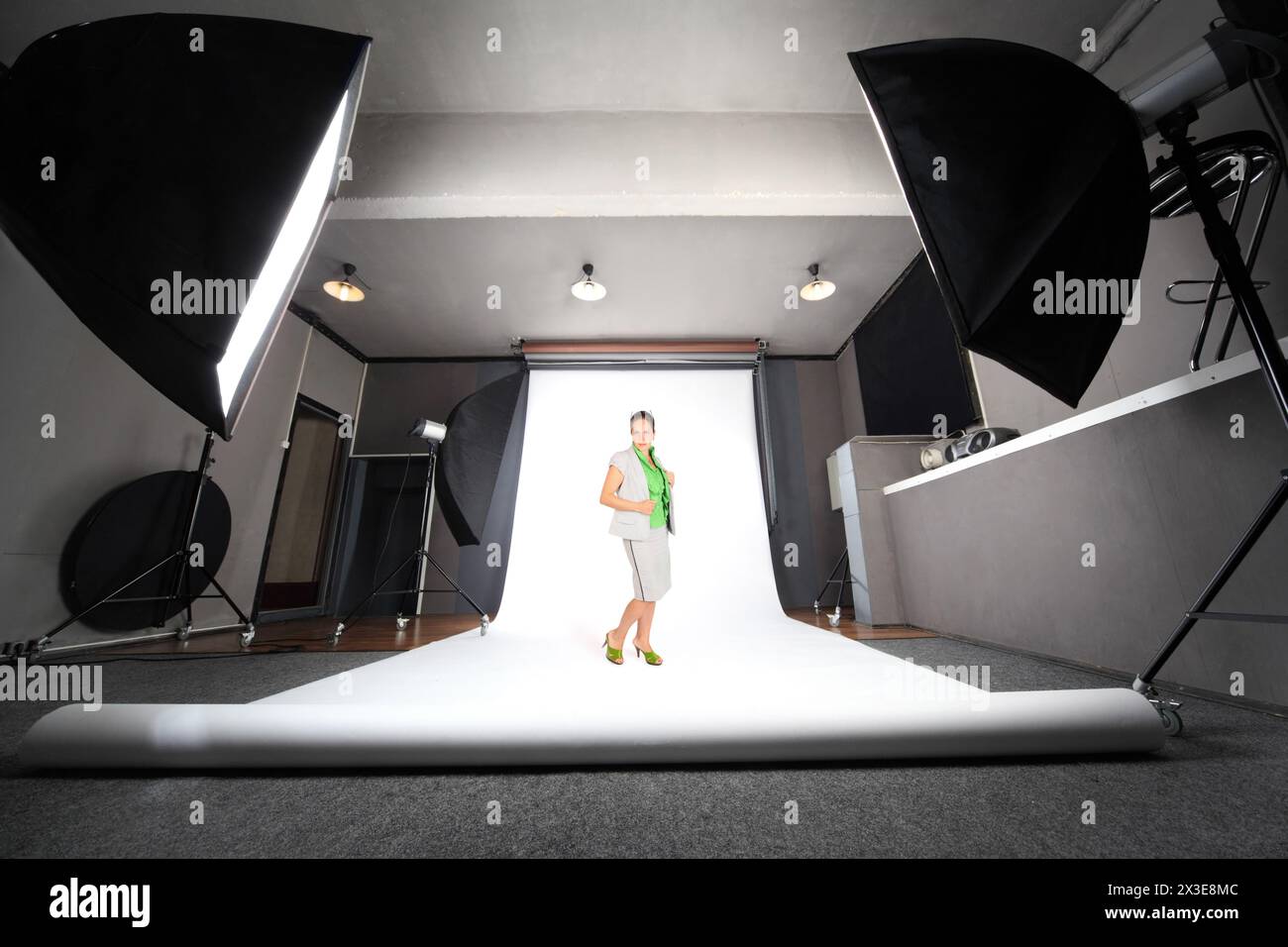 Woman poses in professional photo studio with white background, collage ...