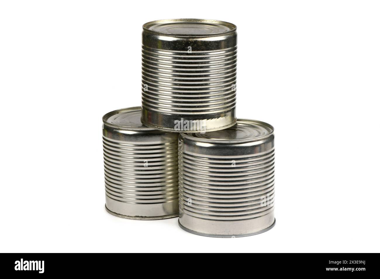 Open metal tin cans placed in pyramid isolated on white background ...