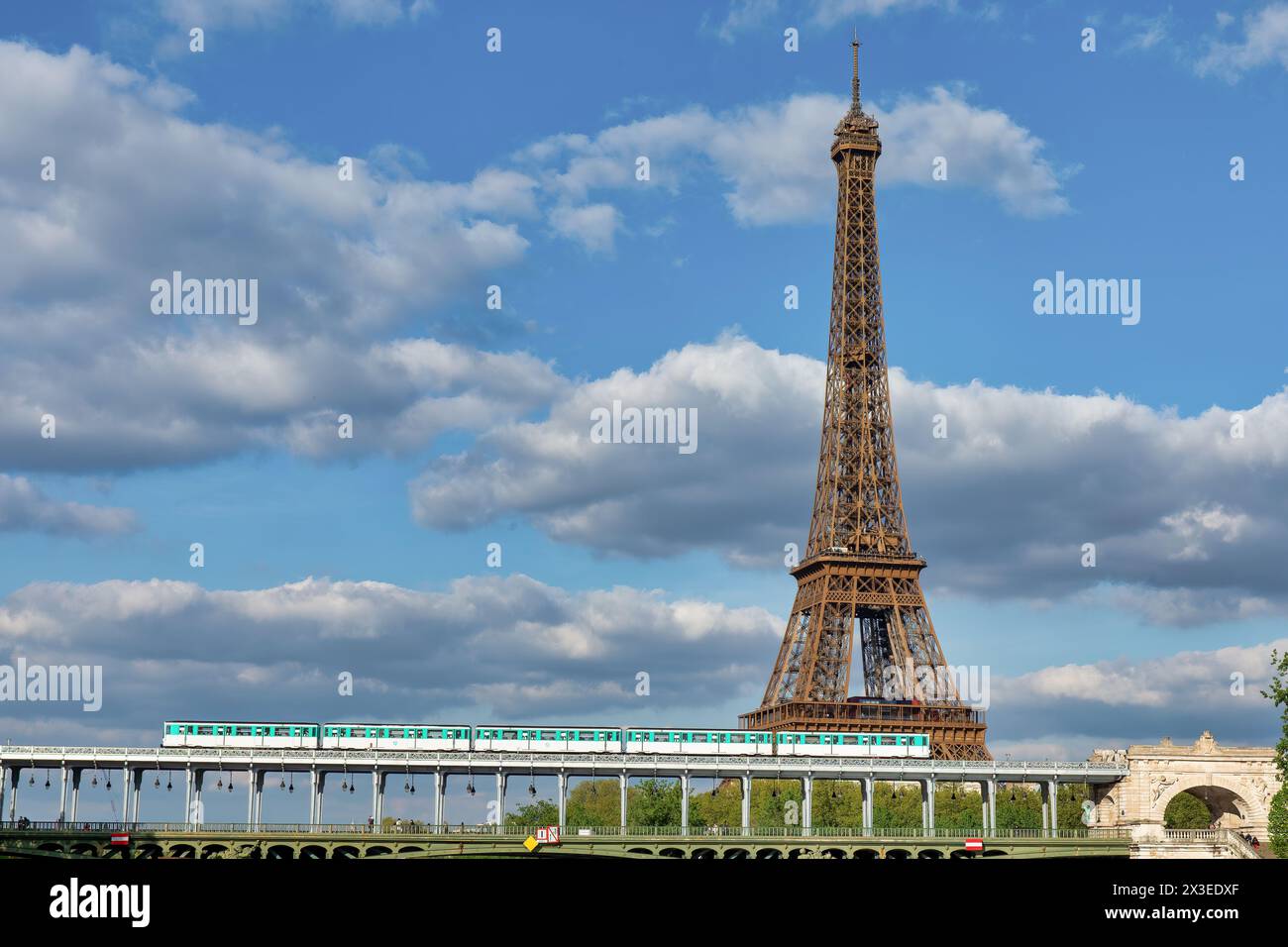 Paris Metro Crossing Iconic Steel Bridge with Eiffel Tower Background ...