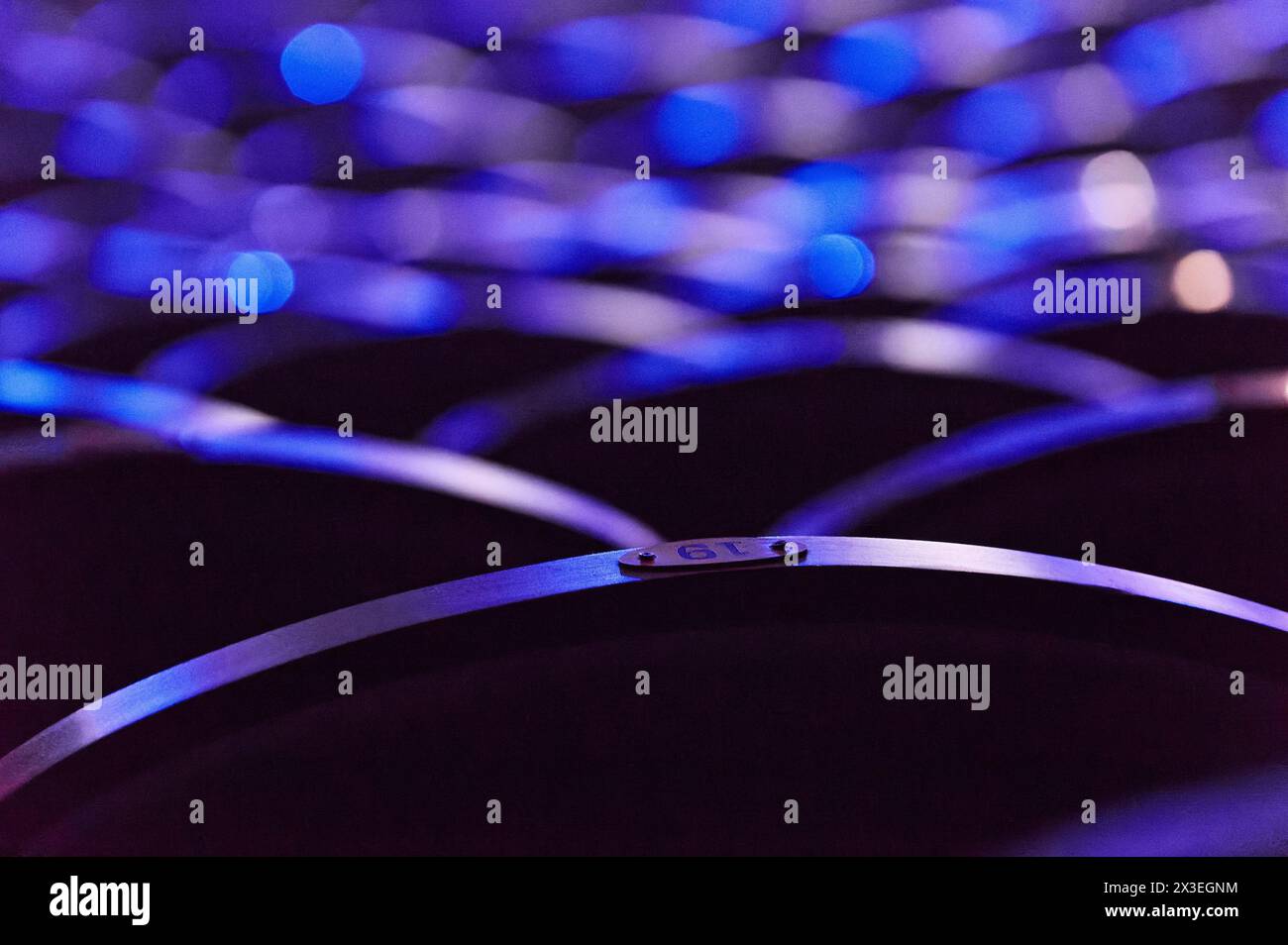 Illuminated Concert Hall Seating in Vibrant Blues Stock Photo - Alamy