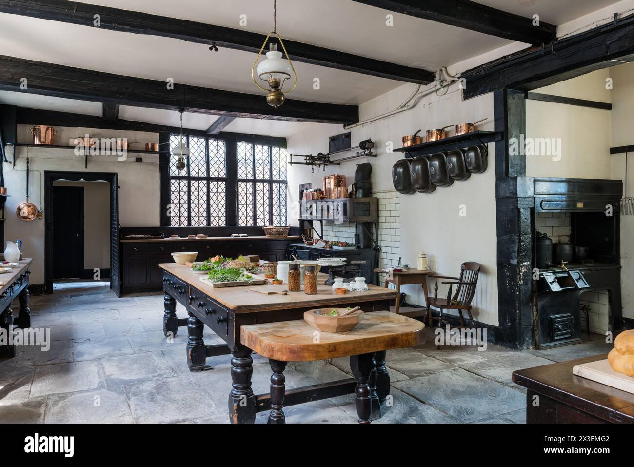 Kitchen table and pans in Speke Hall, Grade I listed National Trust ...