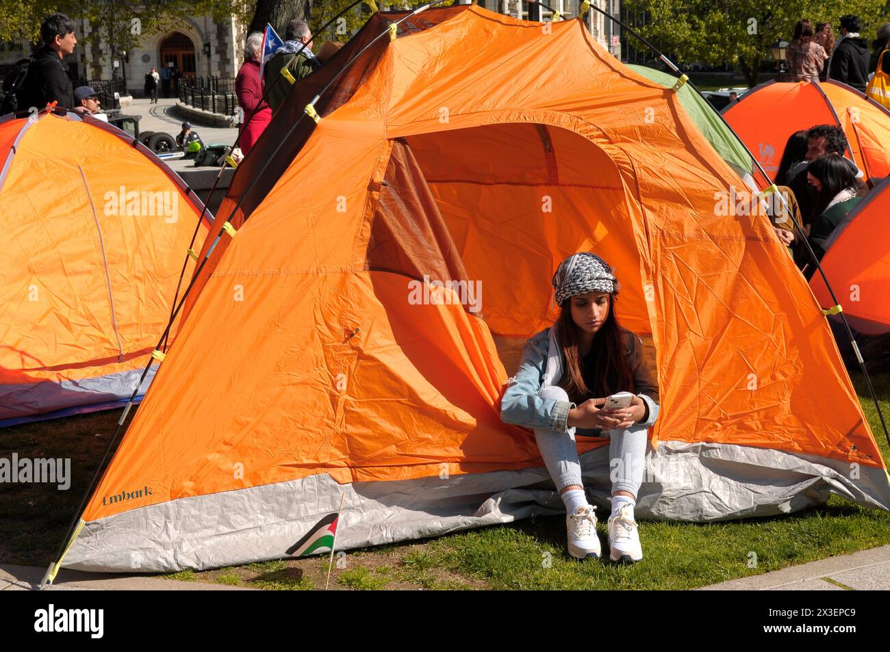 A protester sits at a pro-Palestine encampment at the City College of ...