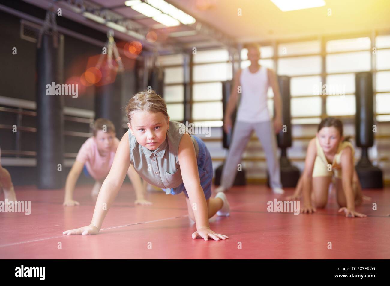 Kids doing push-ups in gym Stock Photo - Alamy
