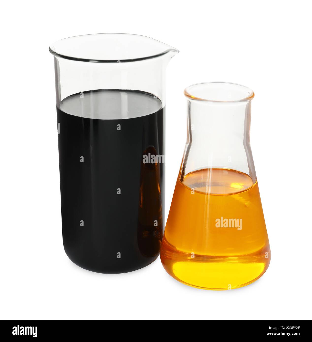 Beaker and flask with different types of oil isolated on white Stock ...