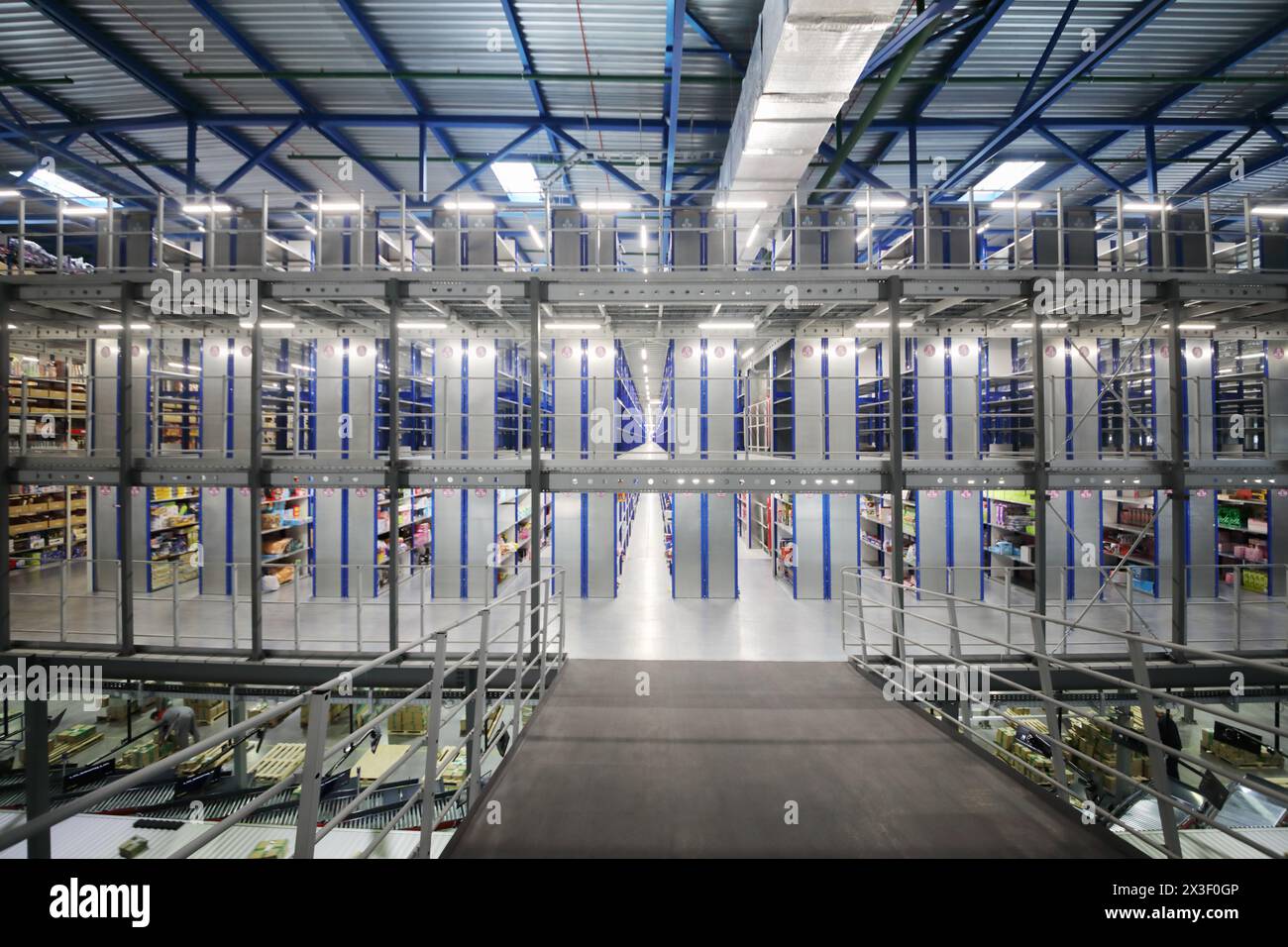 Large warehouse with many shelves with goods - hall in sorting center ...