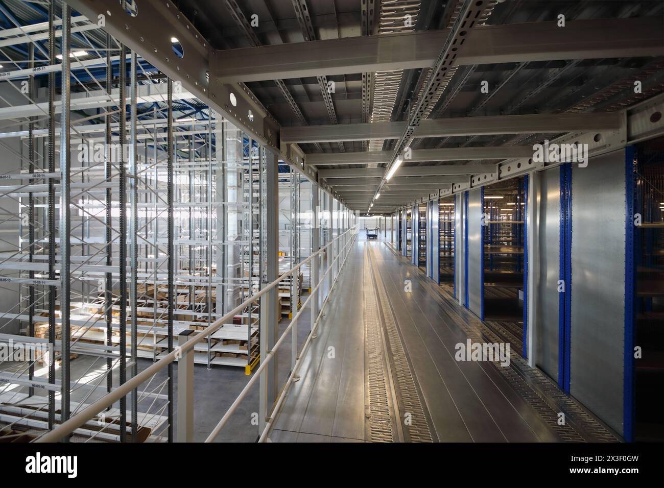 Big modern warehouse with many shelves - long hallway in sorting center ...