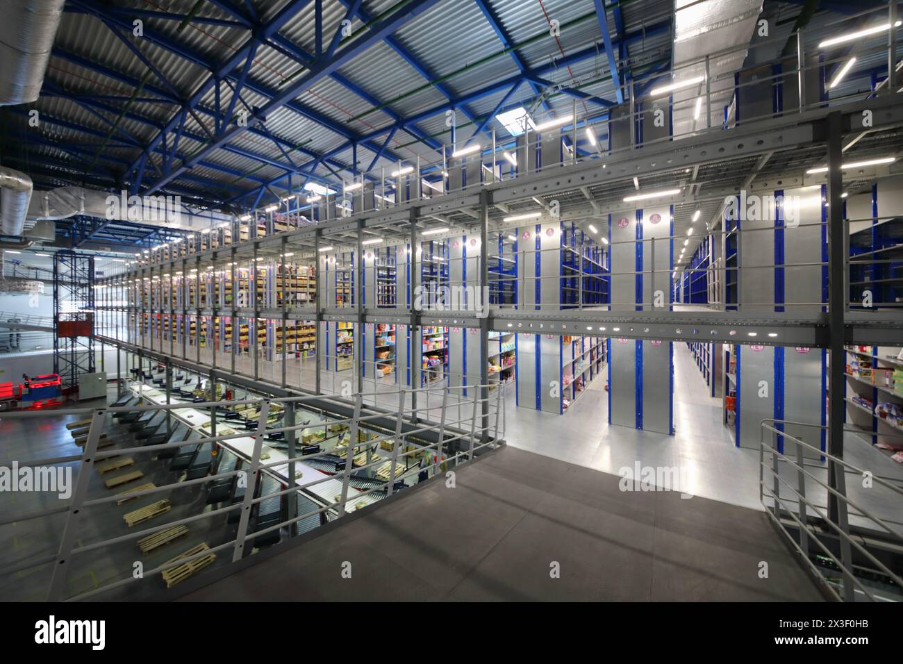 Big empty warehouse with many shelves with goods - hall in sorting ...