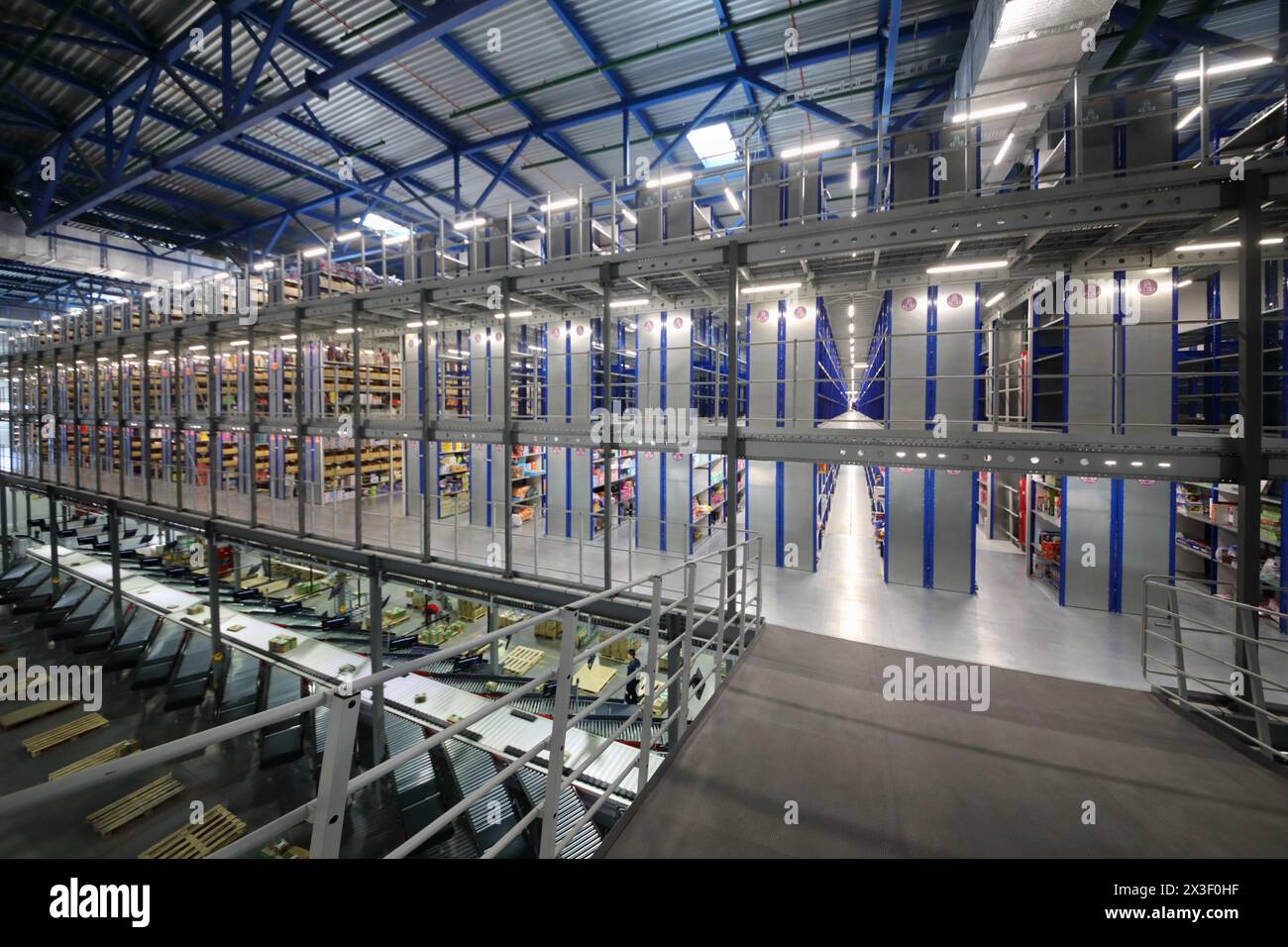 Large modern warehouse with many shelves with goods - hall in sorting ...