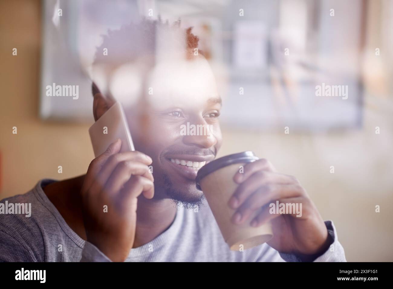 Smile, coffee and black man with phone call by window for communication ...