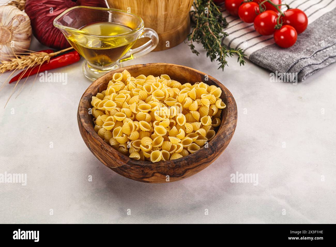 Italian cuisine - dry conchiglie shell pasta Stock Photo - Alamy