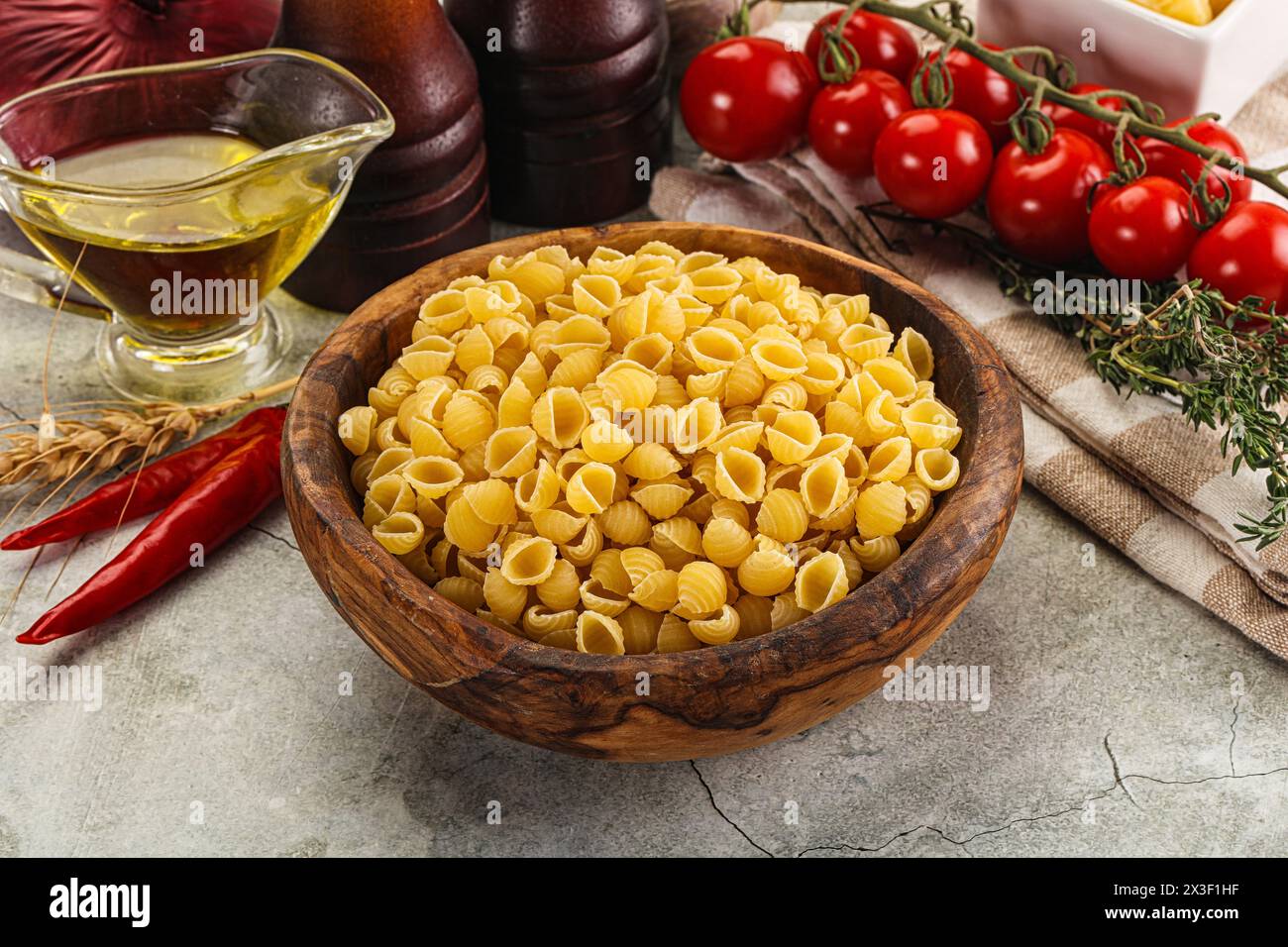 Italian cuisine - dry conchiglie shell pasta Stock Photo - Alamy