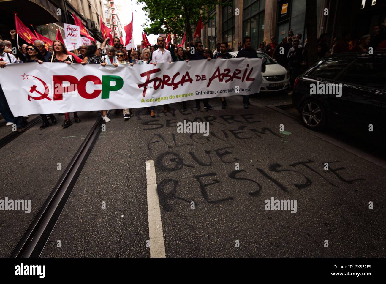 Militants of the Portuguese Communist Party seen passing by a street ...