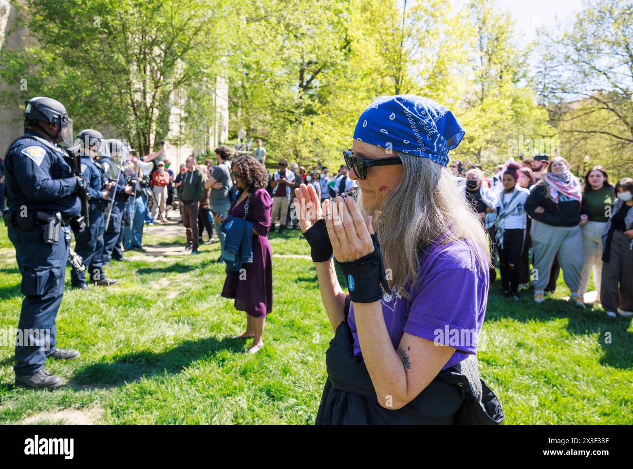 Bloomington, United States. 25th Apr, 2024. A woman seen as dozens of ...