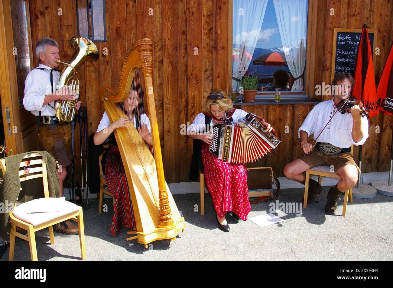 Musicians playing traditional Austrian Music in traditional dress Stock ...