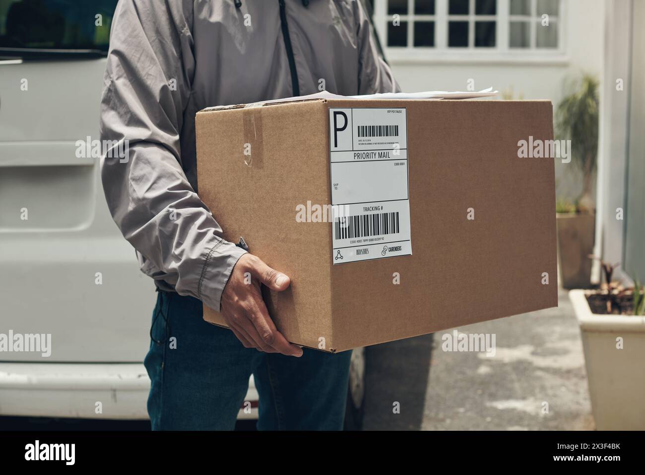 Closeup, delivery and man with box, courier and doorway with ecommerce ...