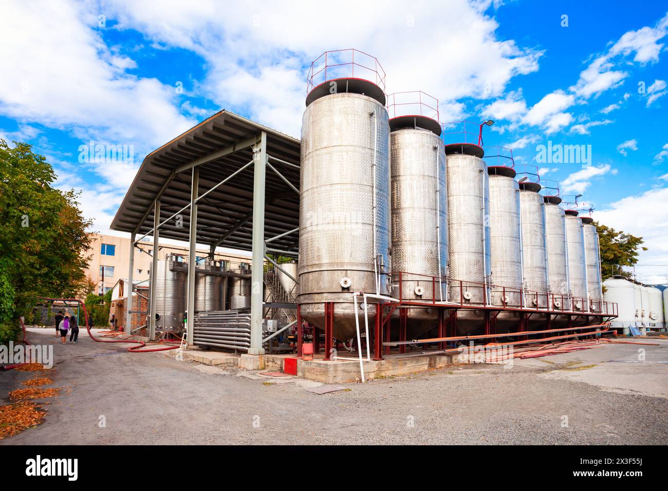 Stainless steel storage tanks with wine at open air Stock Photo - Alamy