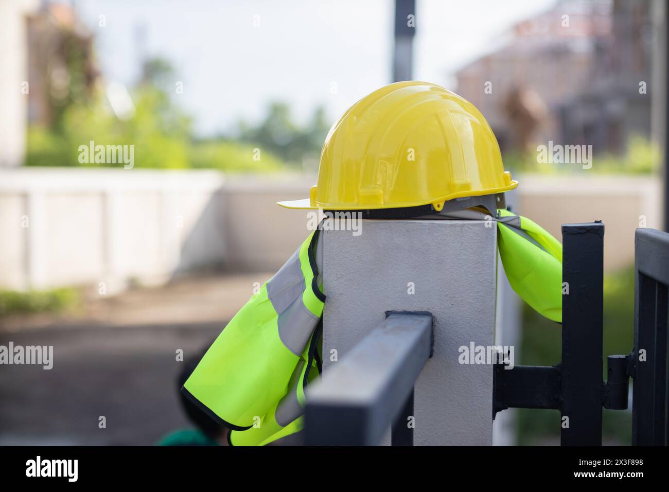 Yellow safety helmet are provided along with reflective vests for workers wear because Yellow ...