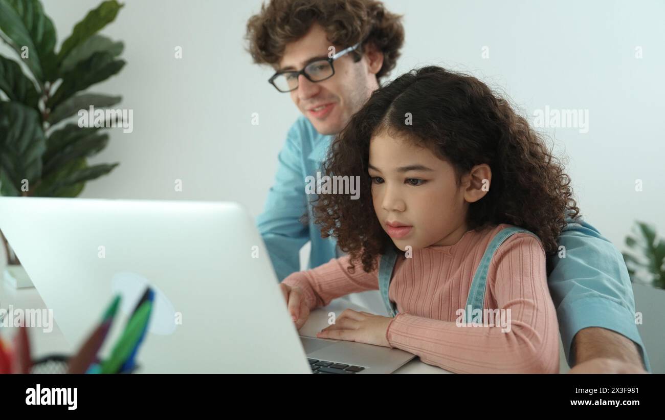 Caucasian father teaching attractive daughter about coding engineering ...
