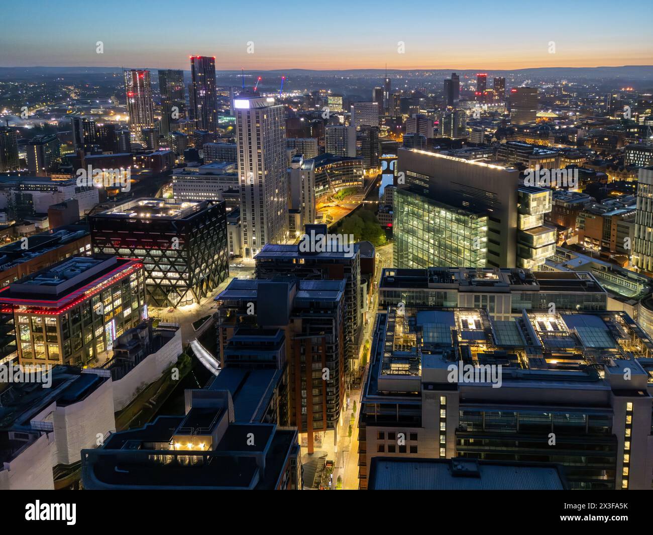 Captivating twilight cityscape with illuminated buildings, roads, and ...