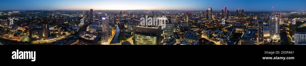 The panoramic image captures a striking sunset descending behind ...