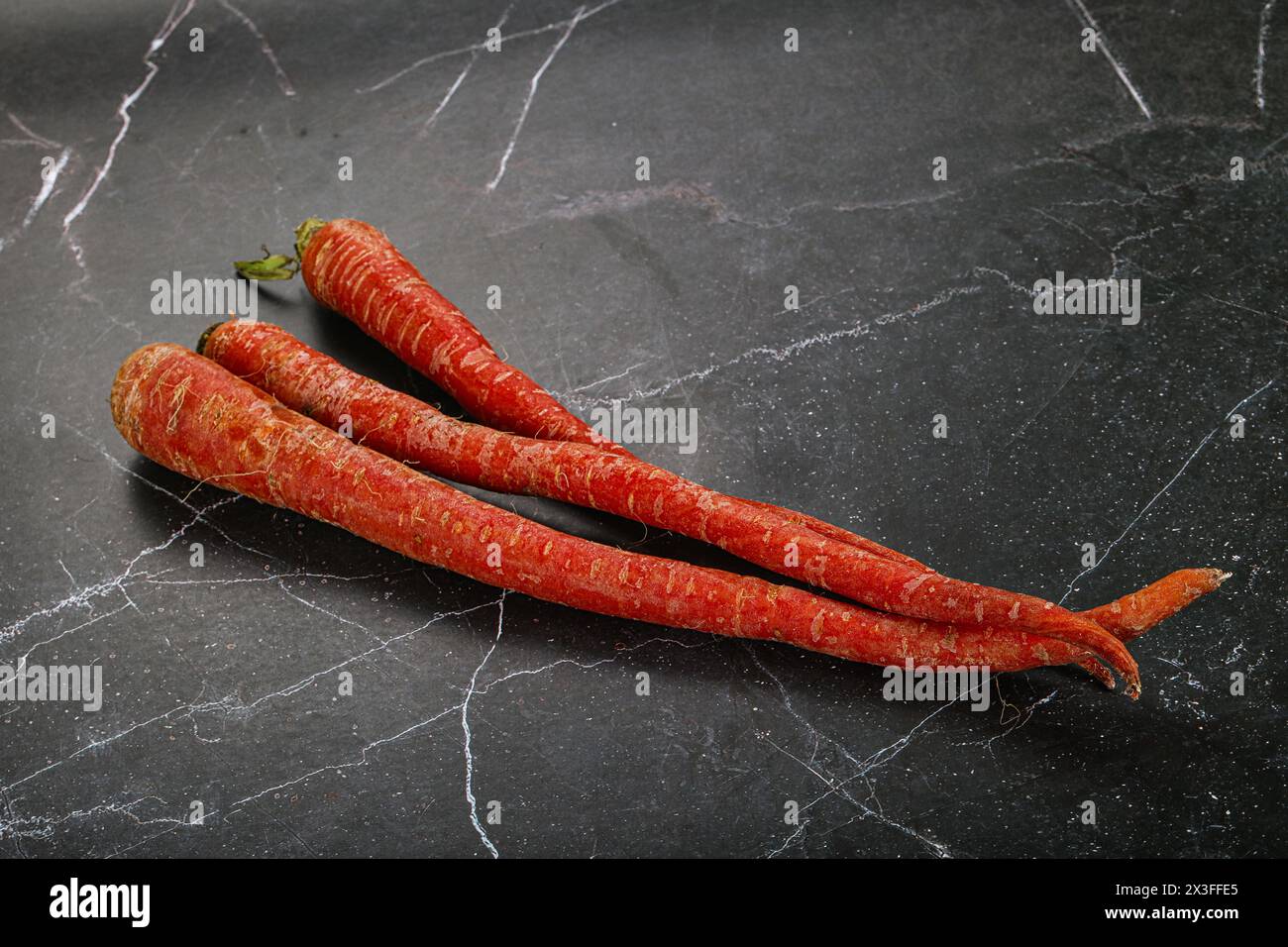 Raw ripe Indian red carrot root Stock Photo - Alamy