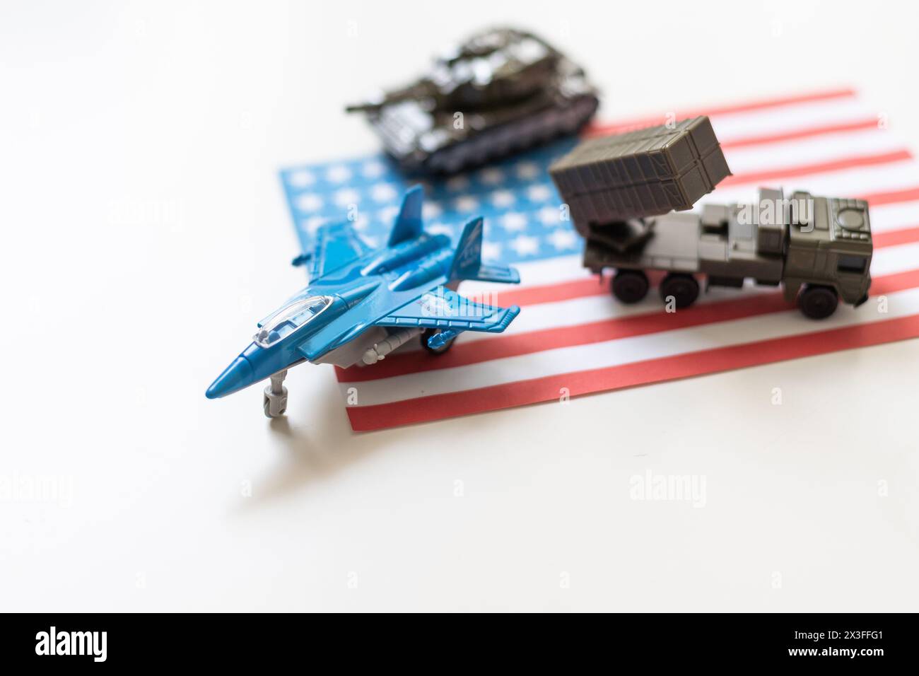 Miniature toy soldiers in battle scene with american flag background ...