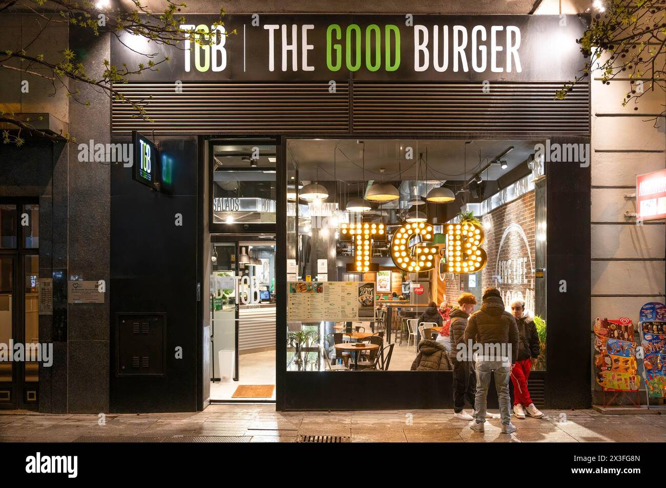 People are seen outside the Spanish fast food chain and New York City ...