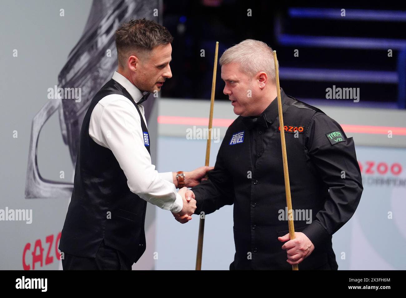David Gilbert (left) embraces Robert Milkins after winning their match ...