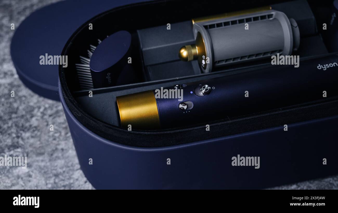 Jurmala, Latvia 23.04.2024: A blue box with a black lid and Dyson hair ...