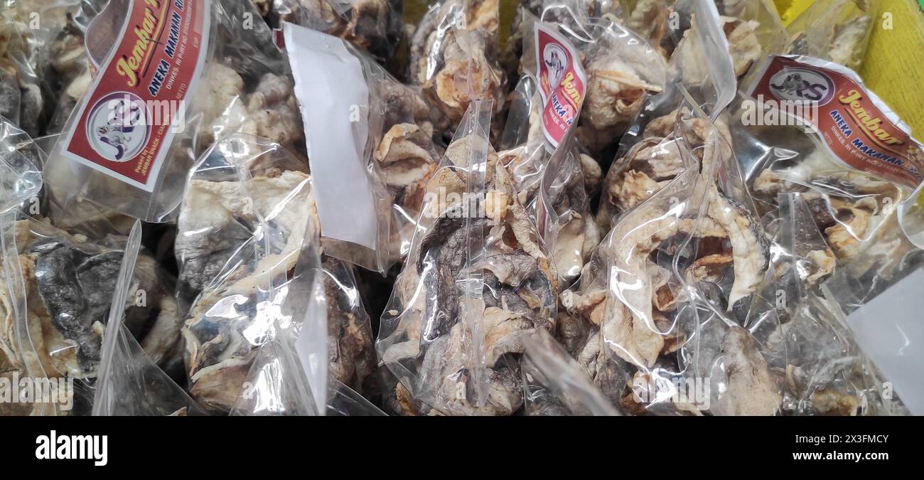 various kinds of dry snacks wrapped in plastic, central souvenirs with ...