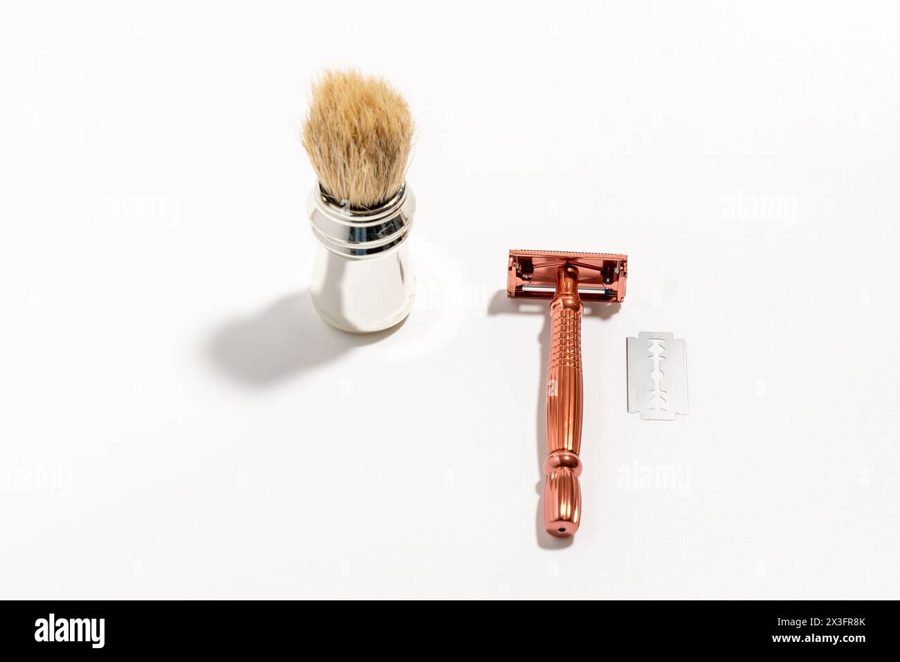 Metal razor and pen brush on a white background. Razor close-up Stock ...