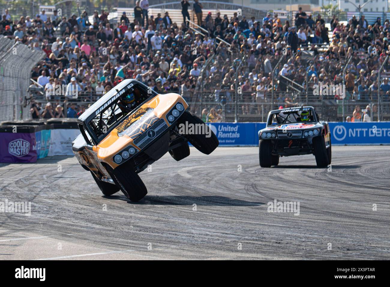 Matt Brabham (left) and Myles Cheek (right) come into the final corner ...