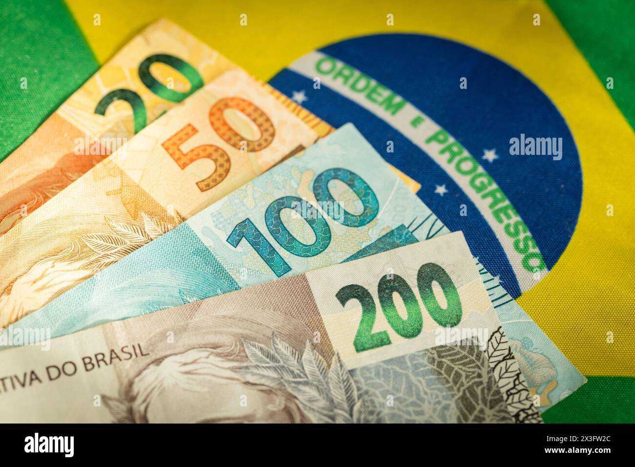 Brazilian money on the background of the national flag, Symbols of ...