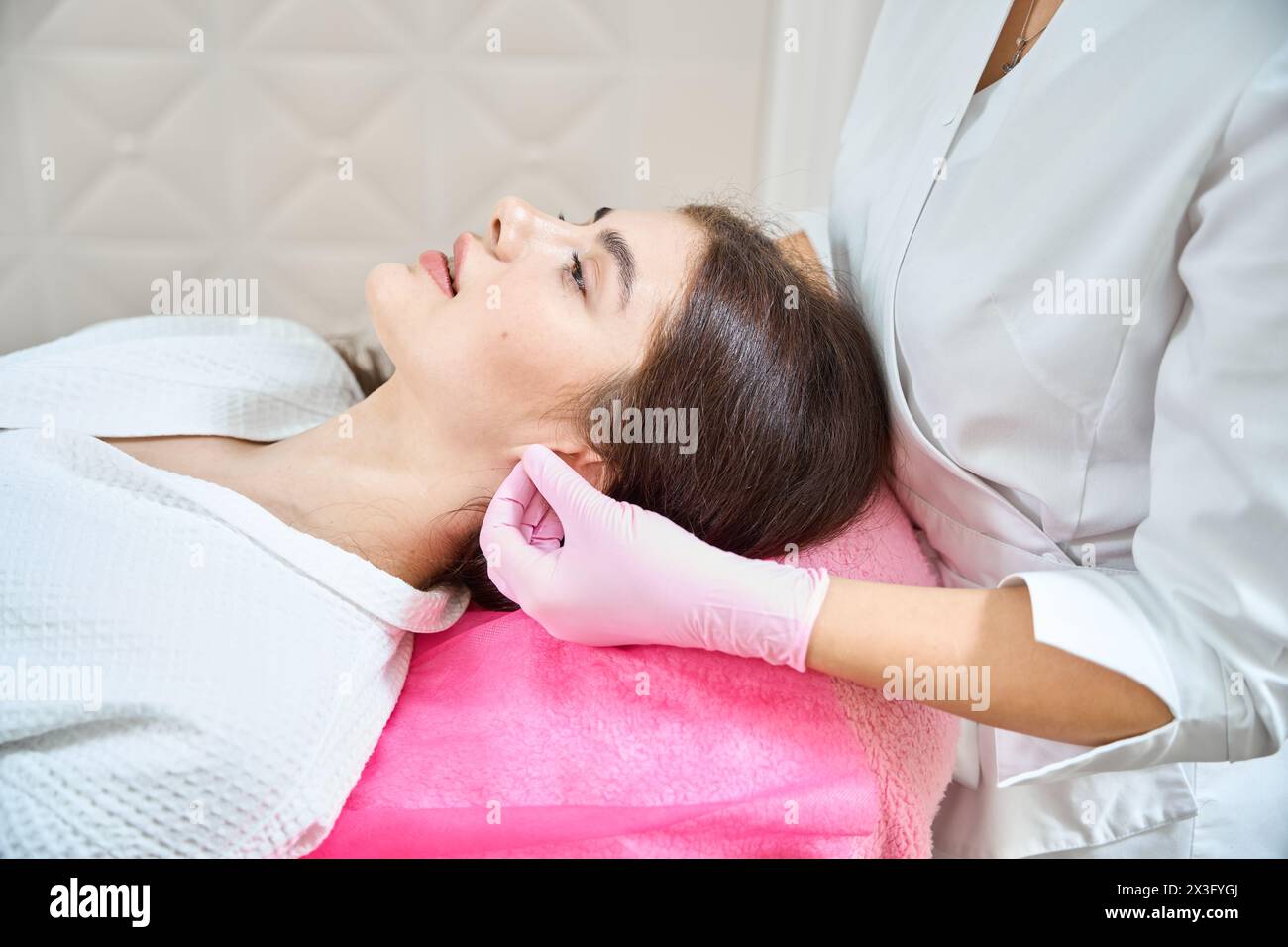 Woman earlobe massage hi-res stock photography and images - Alamy